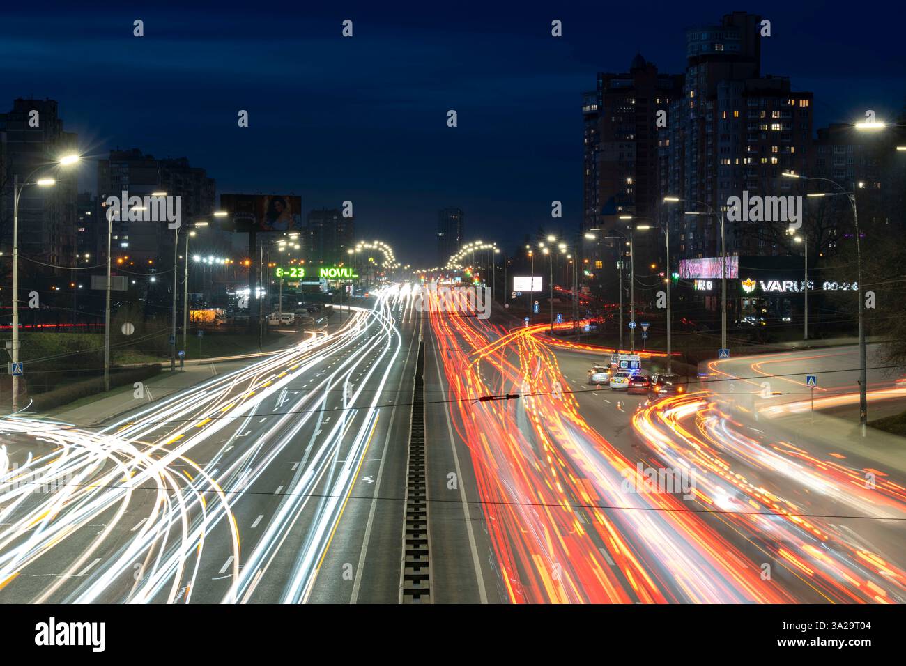 Long exposure of evening traffic on Highway M07 in Kyiv, Ukraine. The ...