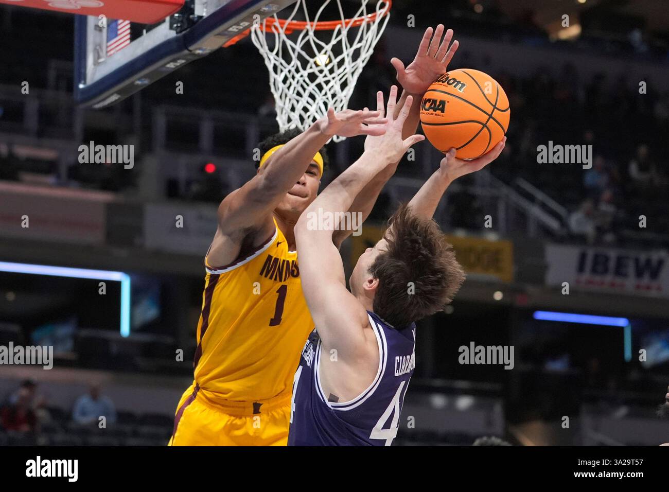 Minnesota guard Isaac Asuma (1) blocks Northwestern guard Angelo ...