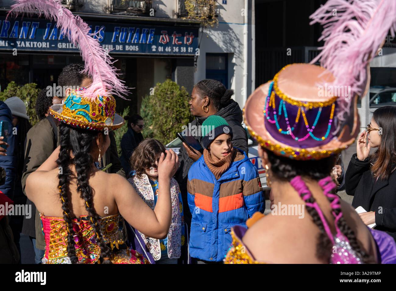Vibrant masks and colorful costumes fill the streets of Paris during ...