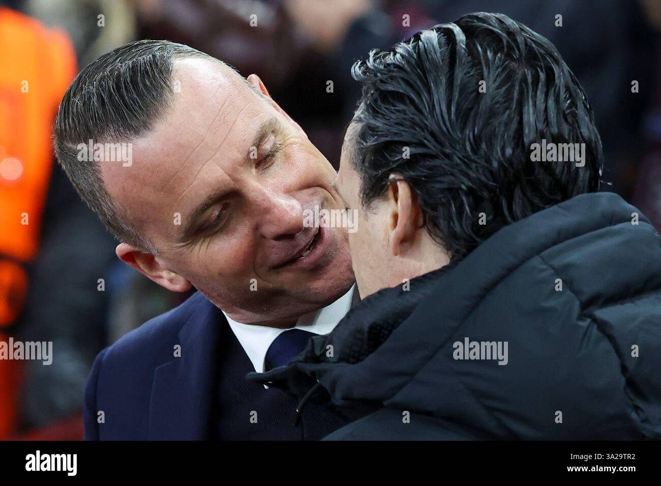 Brugge's head coach Nicky Hayen, left, speaks with Aston Villa's head ...