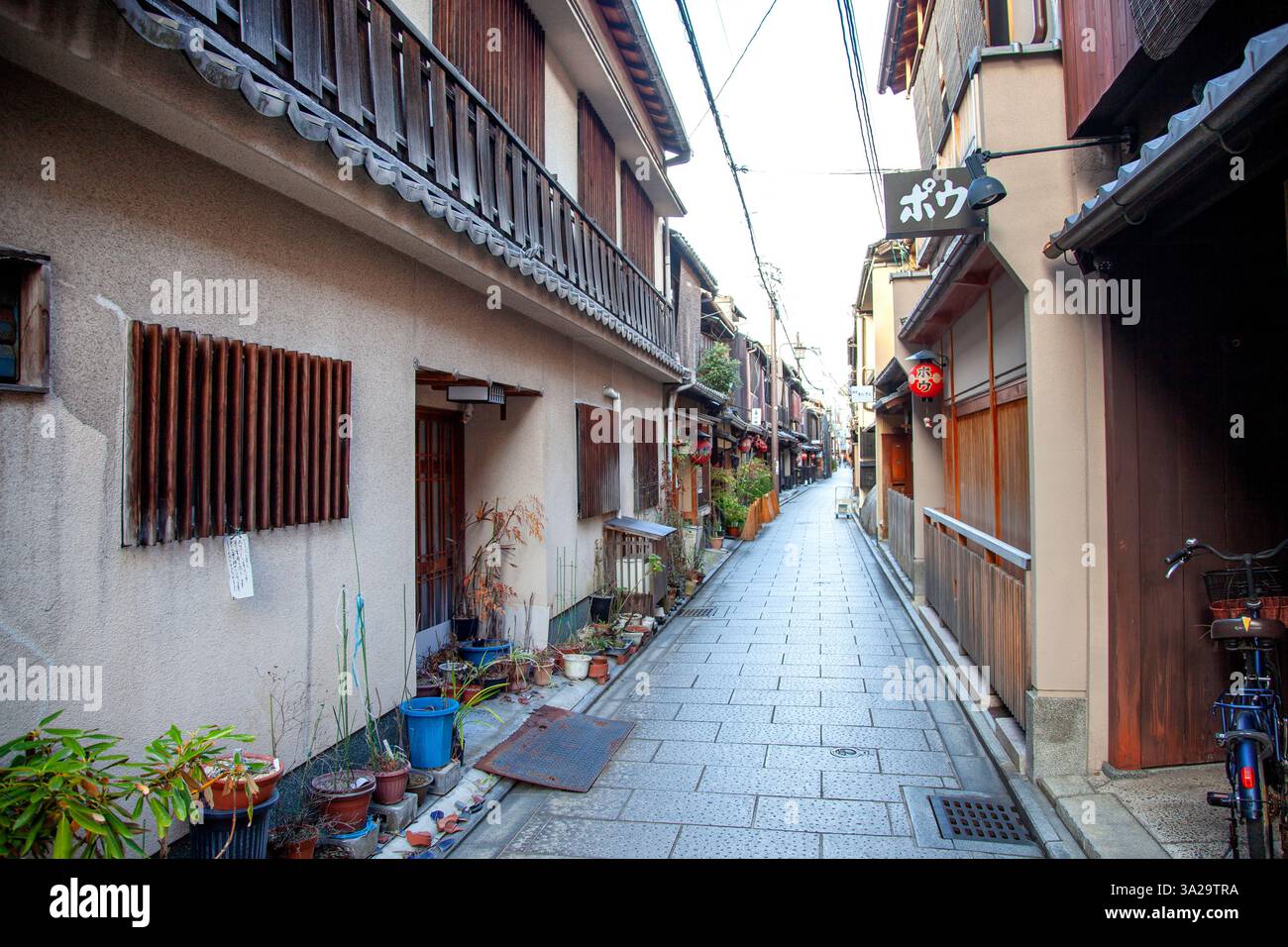 Traditional old wooden buildings and houses in a small alley in ...
