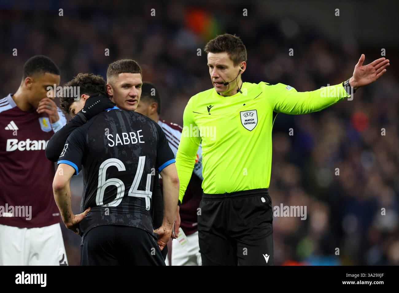 Referee Daniel Siebert, right, shows a red card to Brugge's Kyriani ...