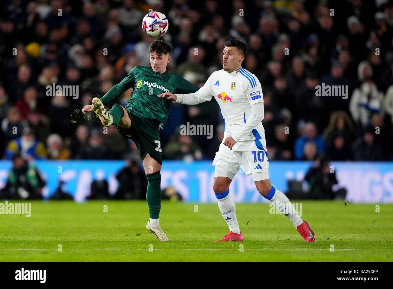 Millwall's Luke Cundle (left) and Leeds United's Joel Piroe battle for ...