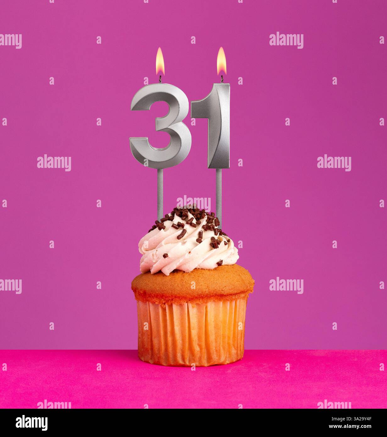 Birthday candle number 31 with cupcake on violet background Stock Photo ...