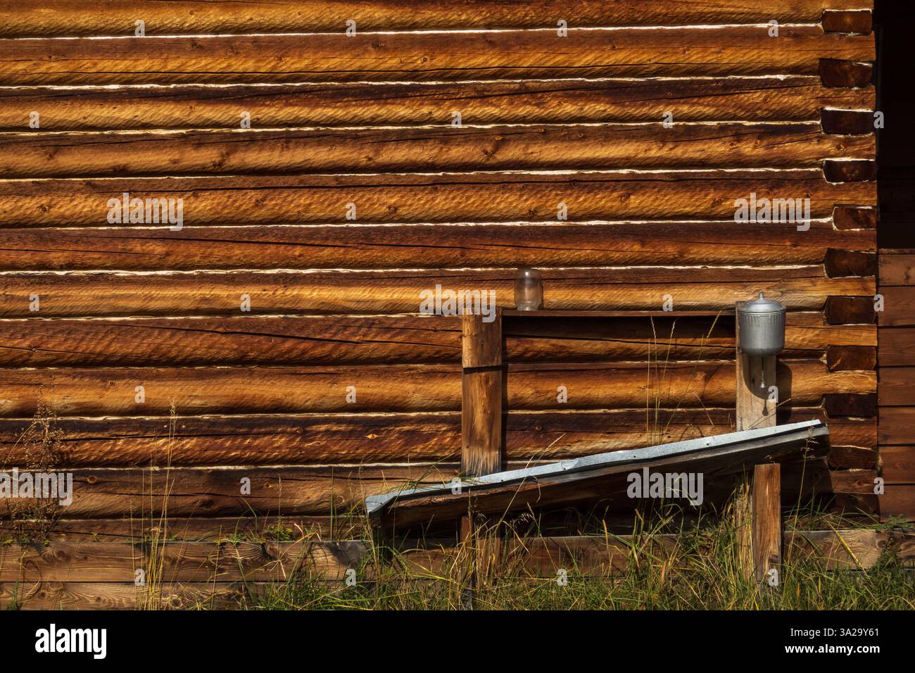Rustic wooden cabin wall with natural texture, silver outdoor accessory ...