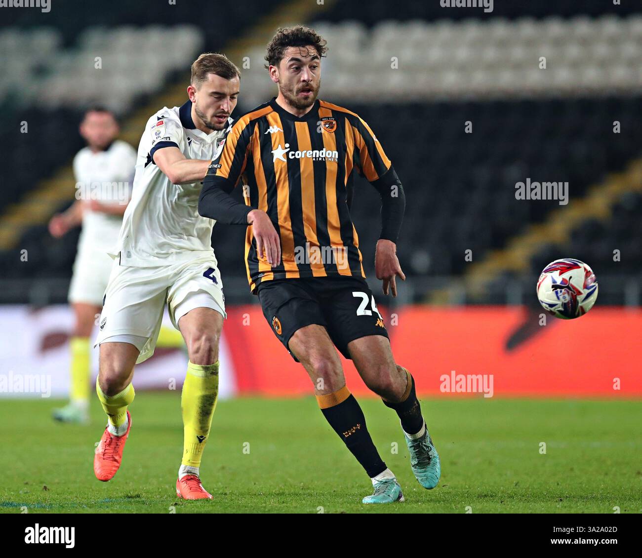 Hull, UK. 12th Mar, 2025. Matt Crooks of Hull City is pressured by ...