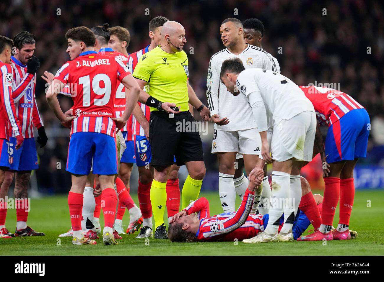 Referee Szymon Marciniak speaks with Real Madrid's Kylian Mbappe while ...