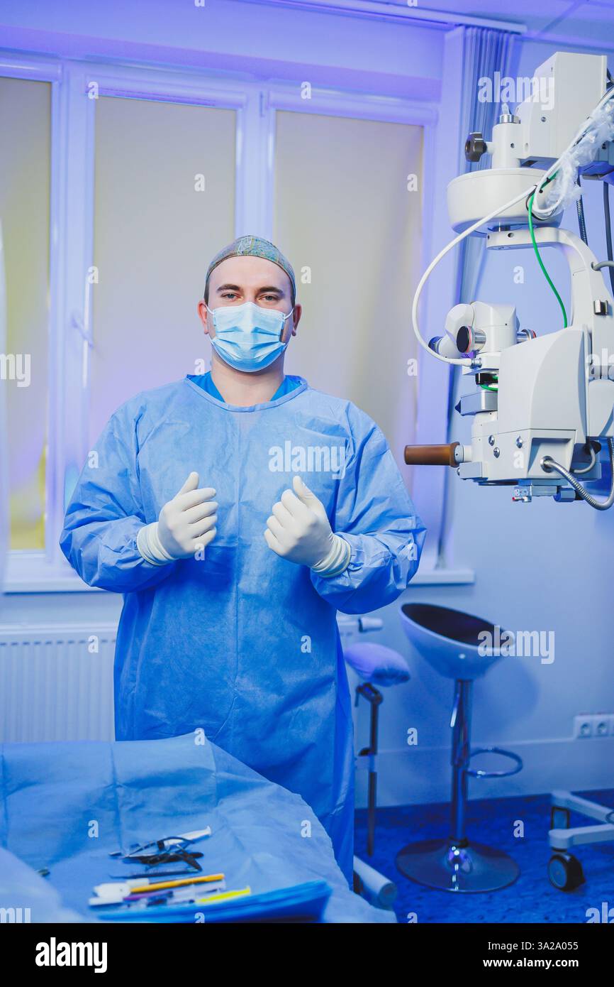A doctor in a surgical suit is standing in the operating room. A doctor ...