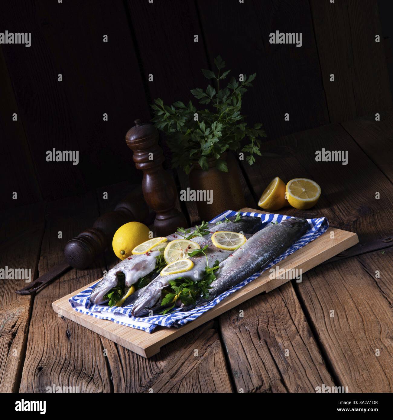Fresh trout with lemon and various herbs Stock Photo - Alamy