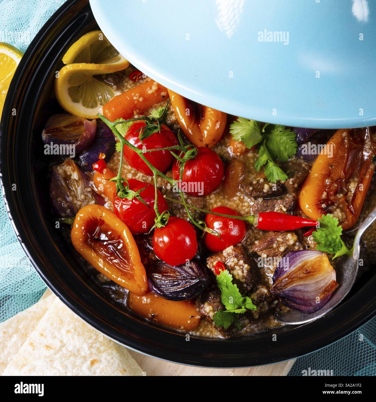 Delicious spicy beef cooked with various vegetables in tagine Stock ...