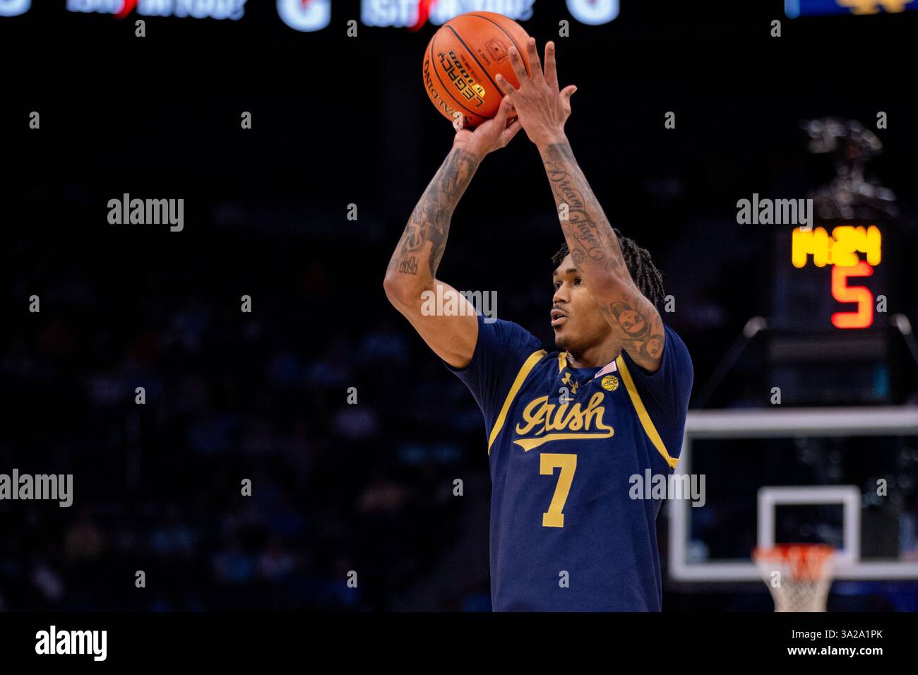 March 12, 2025: Notre Dame Fighting Irish forward Tae Davis (7) shoots ...