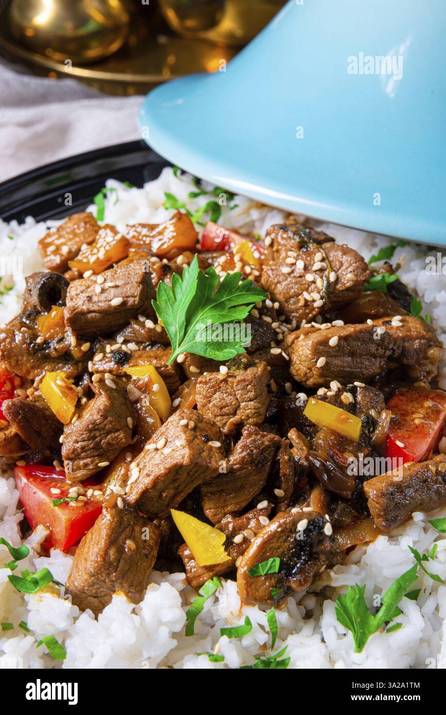 Tajin beef stew with rice, peppers and sesame seeds Stock Photo - Alamy