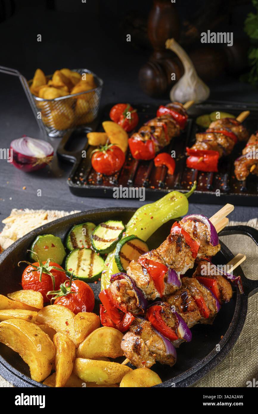 Shish kebab with various vegetables and spices Country potatoes Stock ...