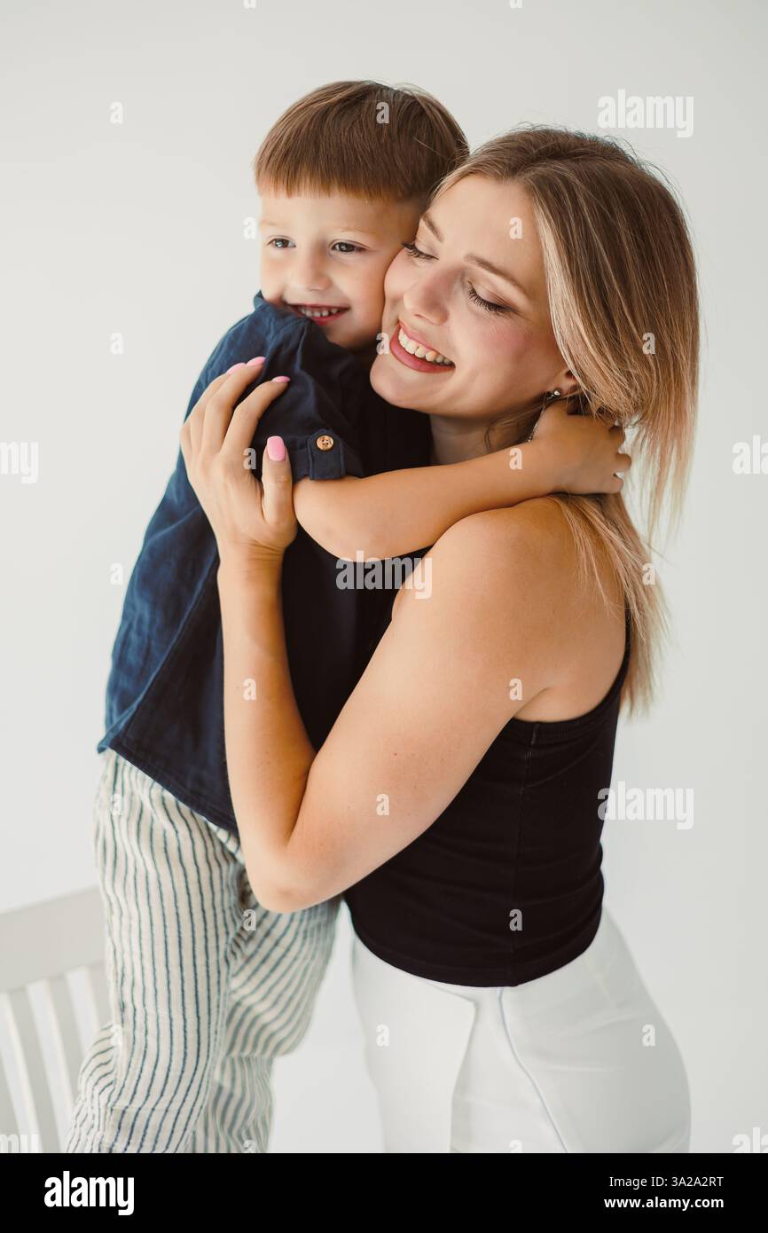 A truly heartwarming moment of a loving mother joyfully embracing her ...