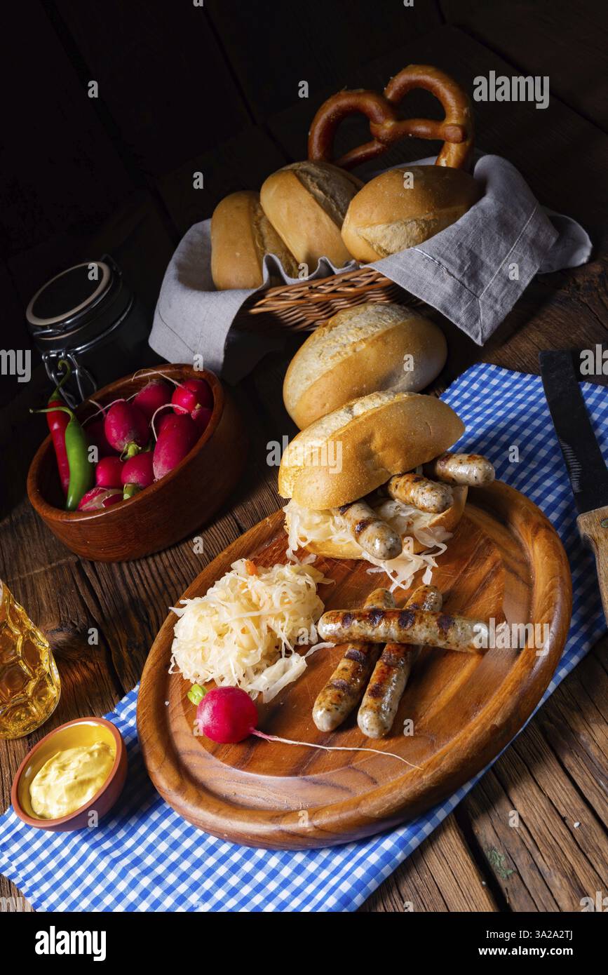 Rustic Thuringian bratwurst with sauerkraut and roll Stock Photo - Alamy
