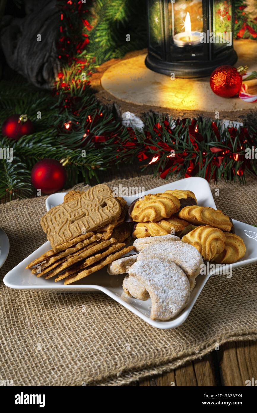 Different types of biscuits with rustic Christmas decorations Stock ...