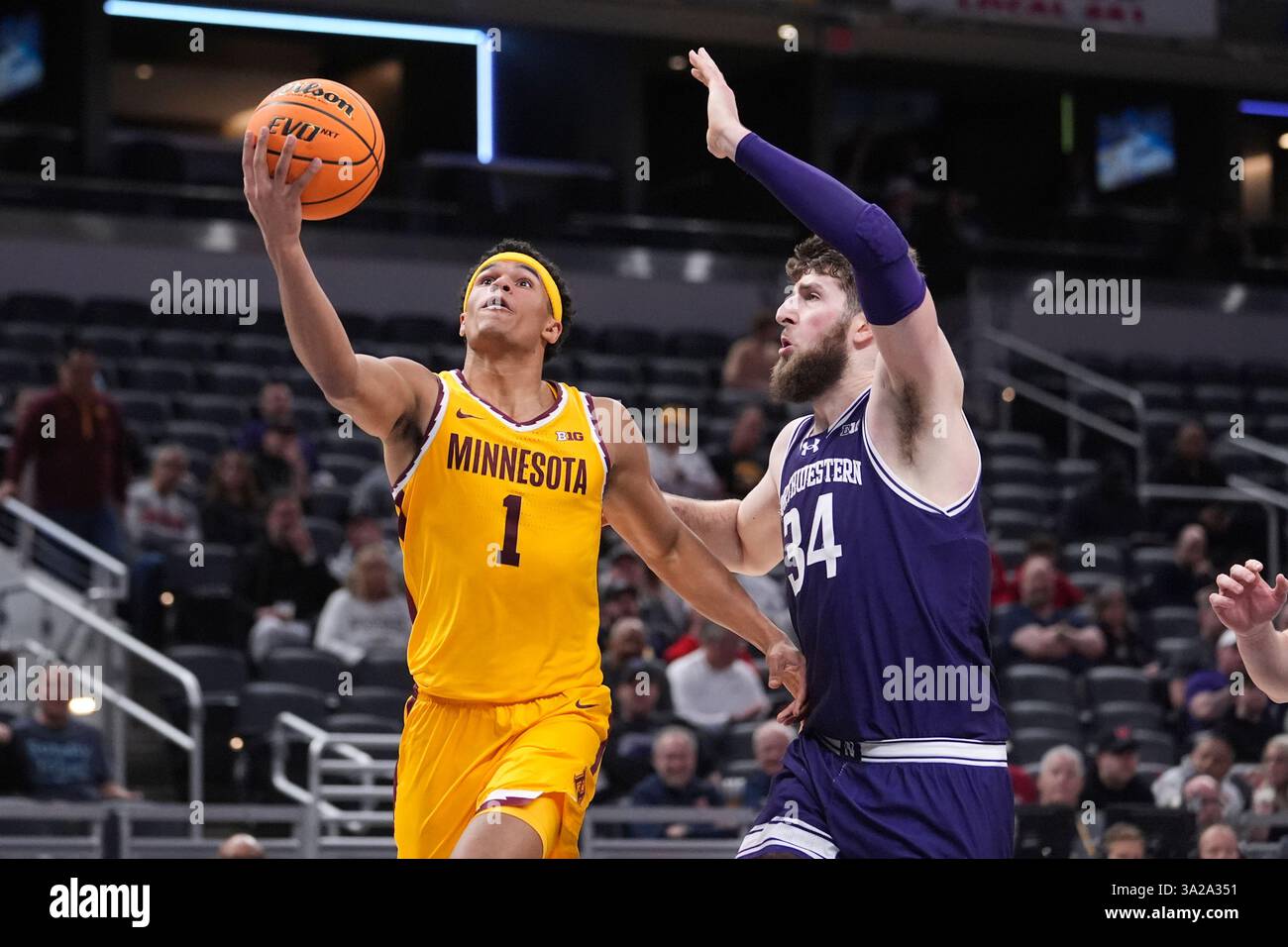 Minnesota guard Isaac Asuma (1) drives on Northwestern center Matthew ...