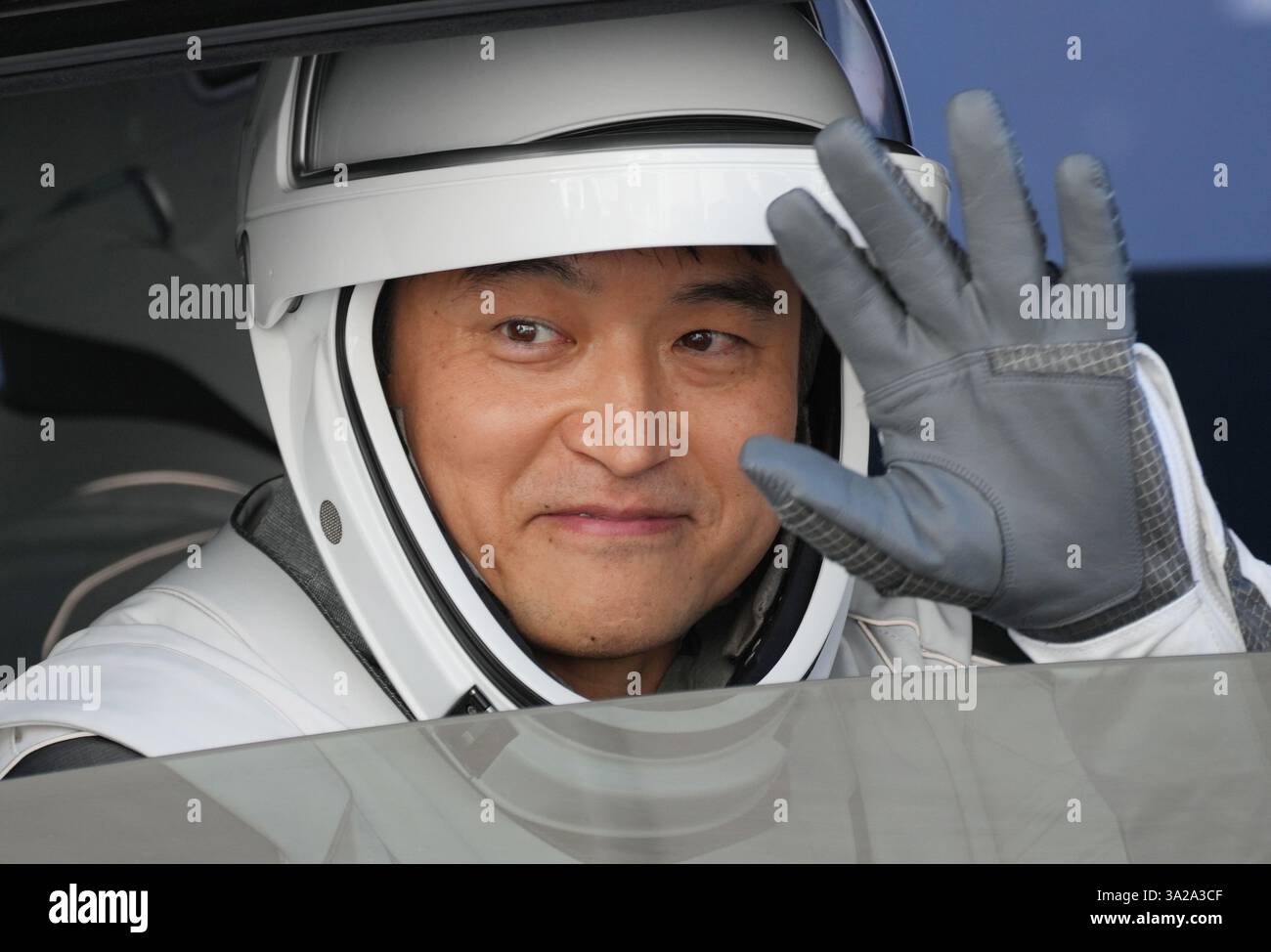 JAXA Astronaut Takuya Onishi of the SpaceX NASA Crew-10 mission waves ...