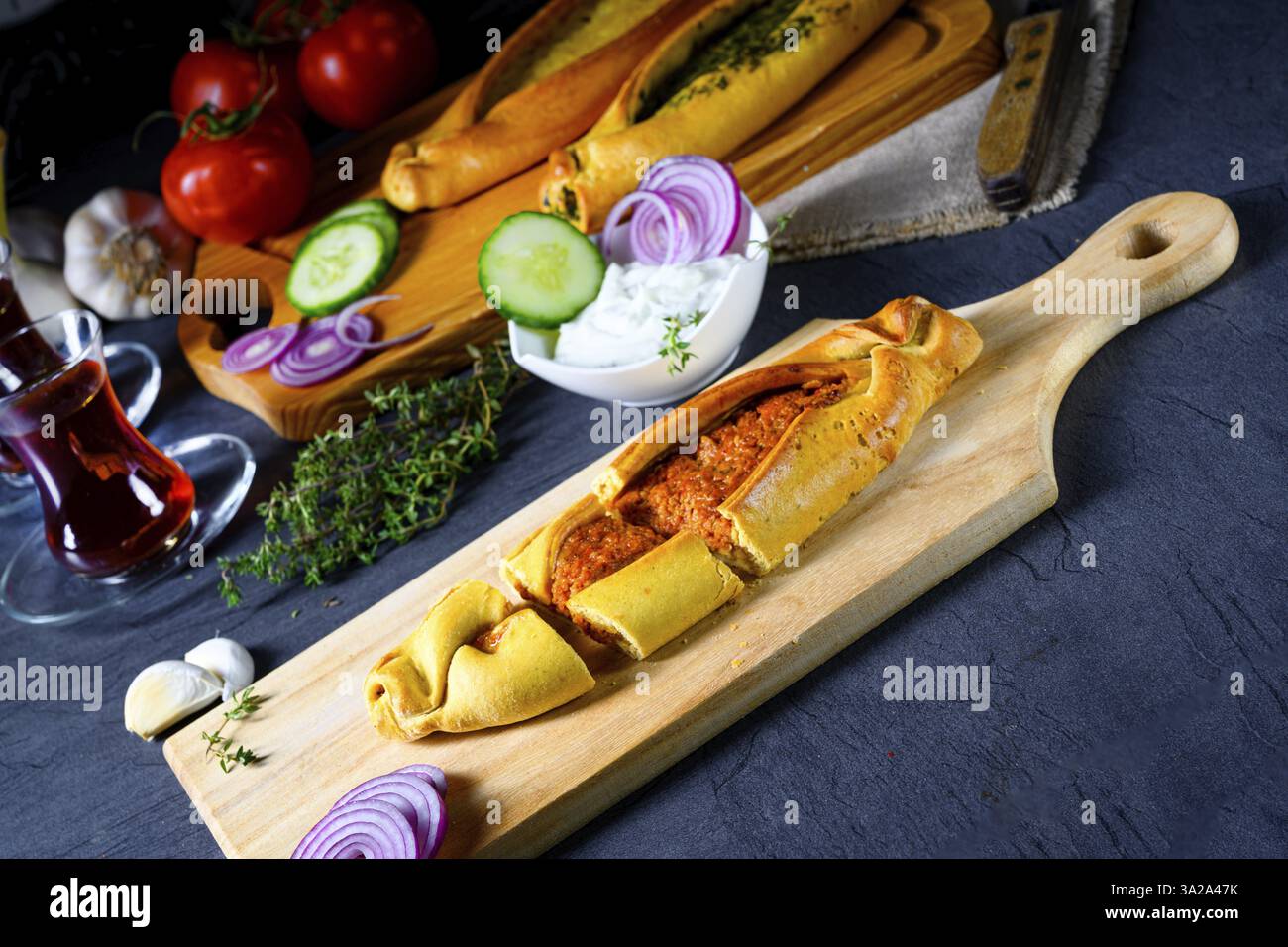 Pide with minced meat, spinach, feta and feta cheese Stock Photo - Alamy