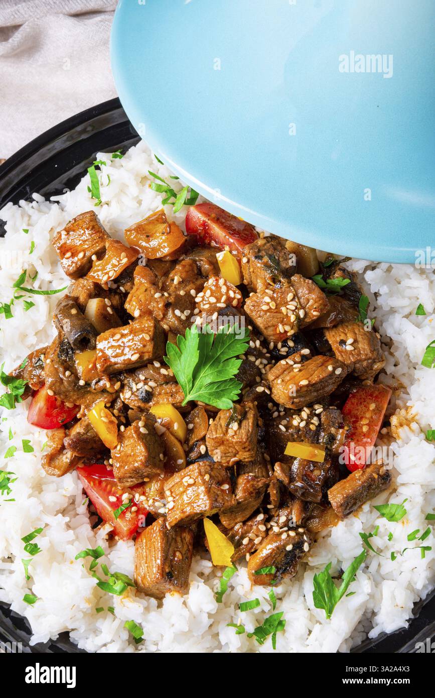 Tajin beef stew with rice, peppers and sesame seeds Stock Photo - Alamy