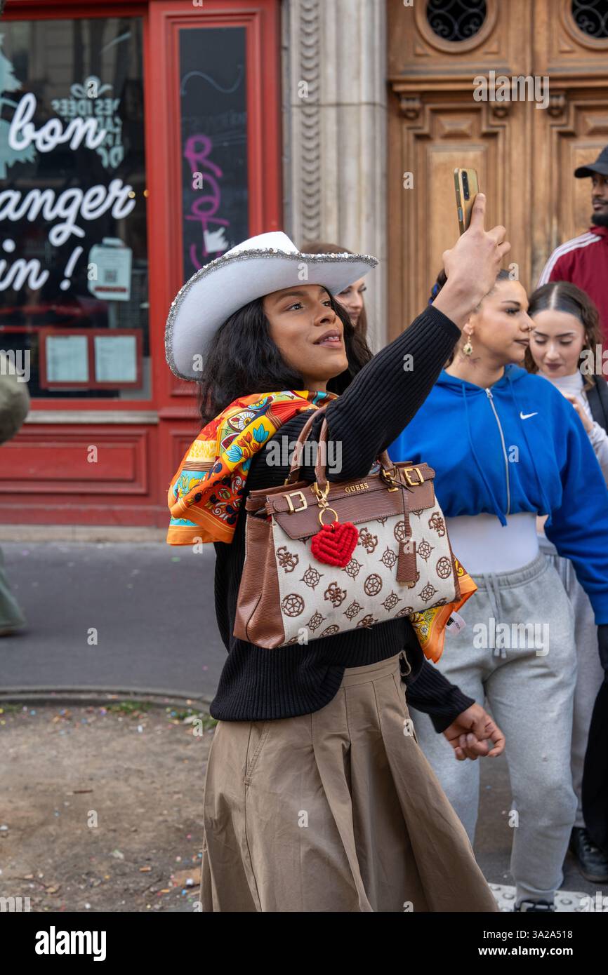 Celebrators revel in vibrant outfits during the festive Paris Carnival ...