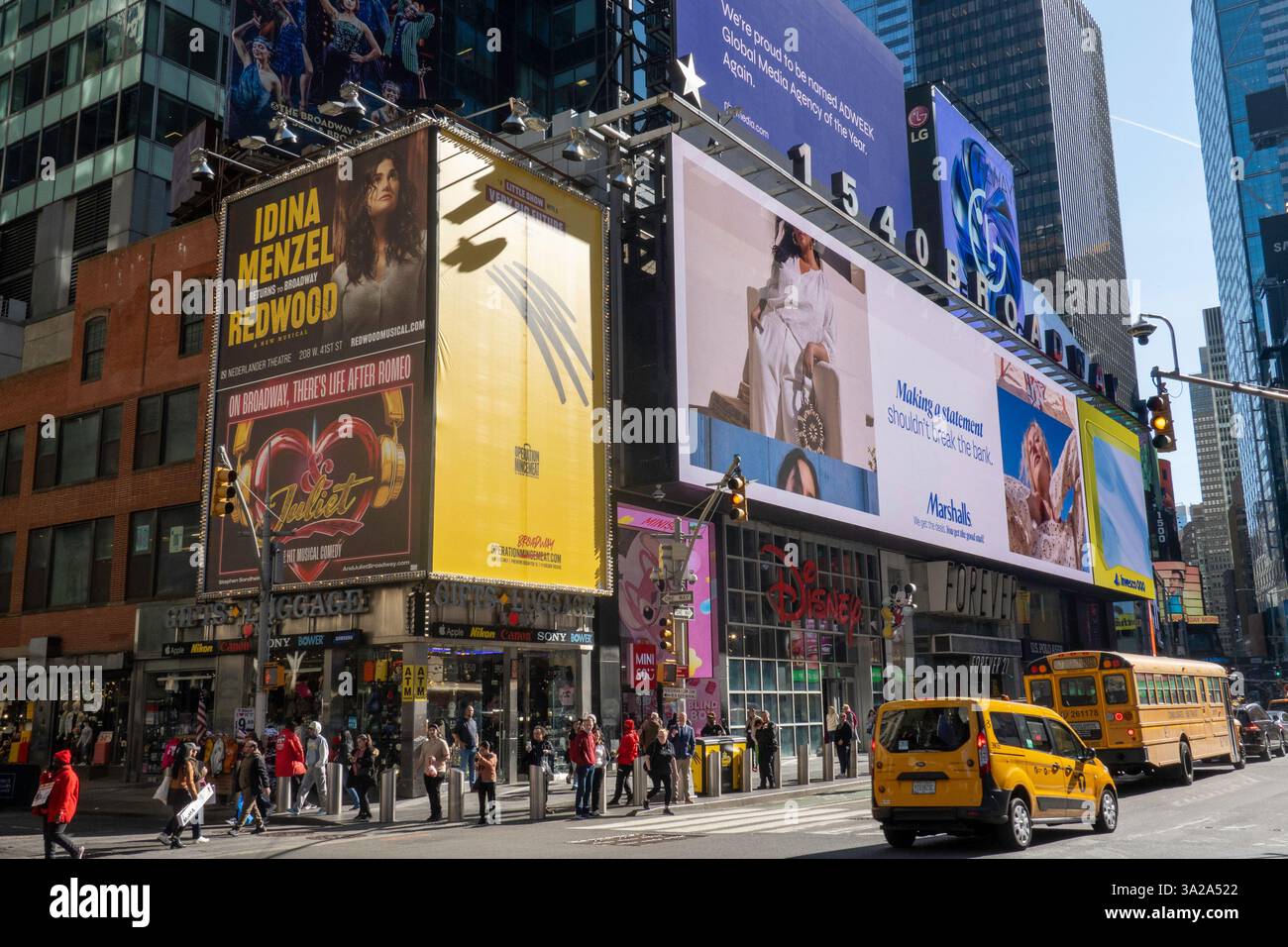 The skyscrapers and office buildings in Times Square are covered in ...
