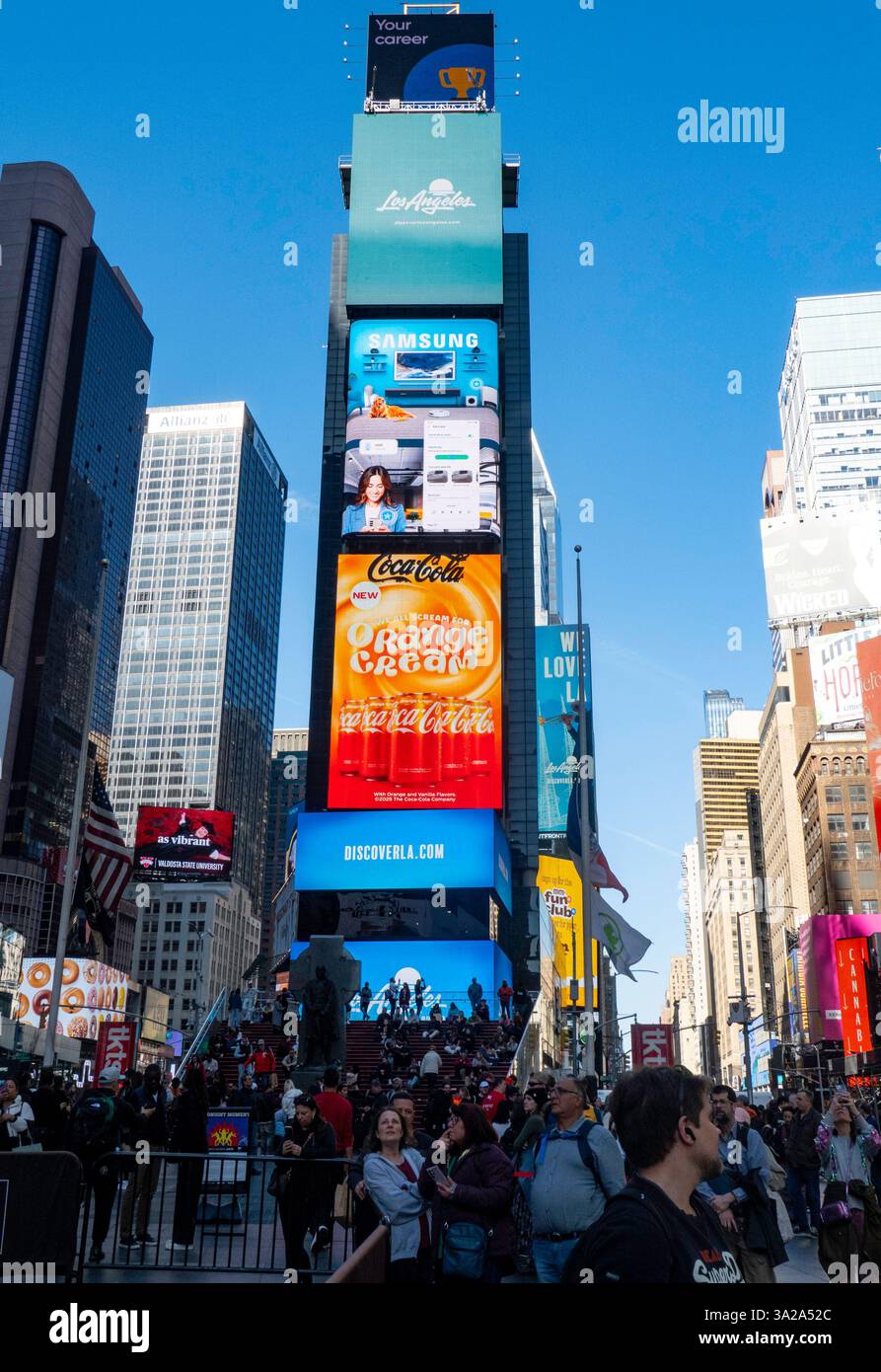 The skyscrapers and office buildings in Times Square are covered in ...