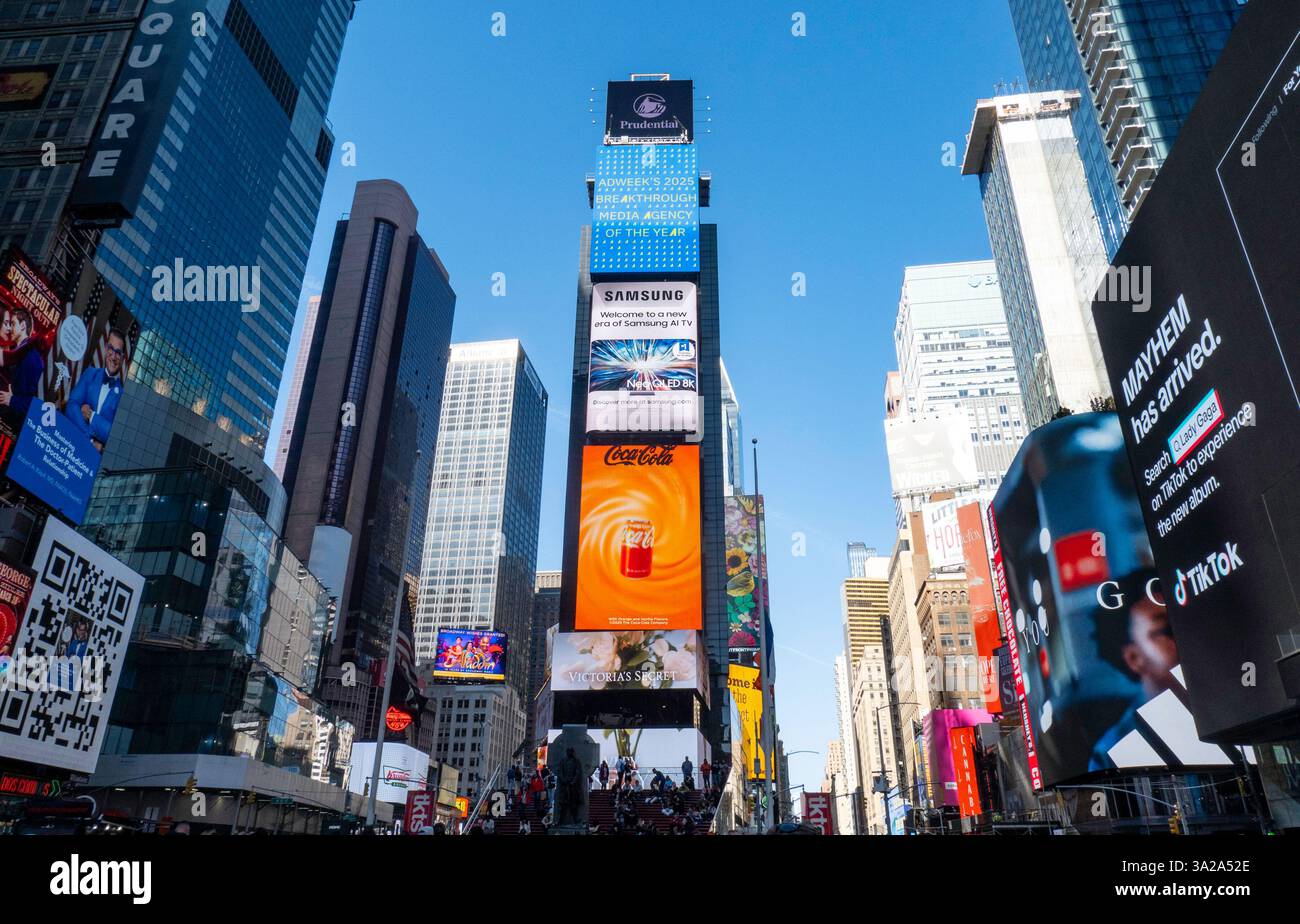 The skyscrapers and office buildings in Times Square are covered in ...