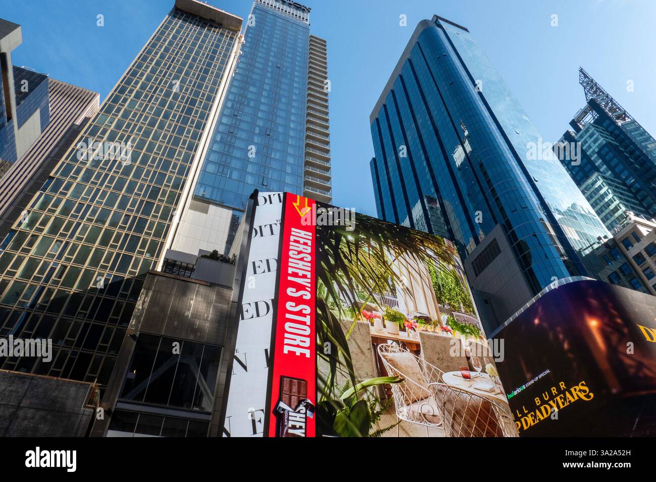 The skyscrapers and office buildings in Times Square are covered in ...