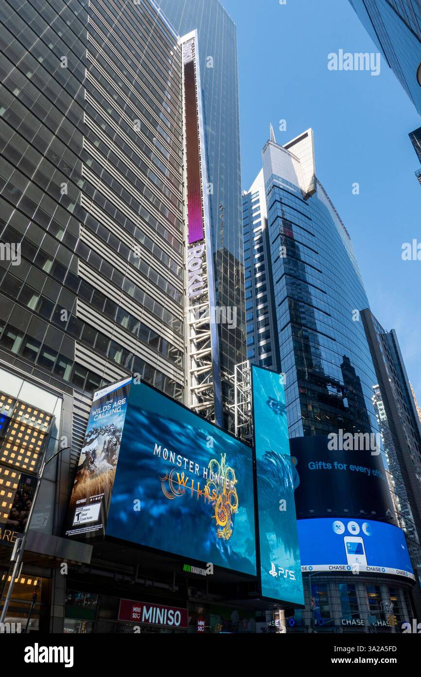 The skyscrapers and office buildings in Times Square are covered in ...