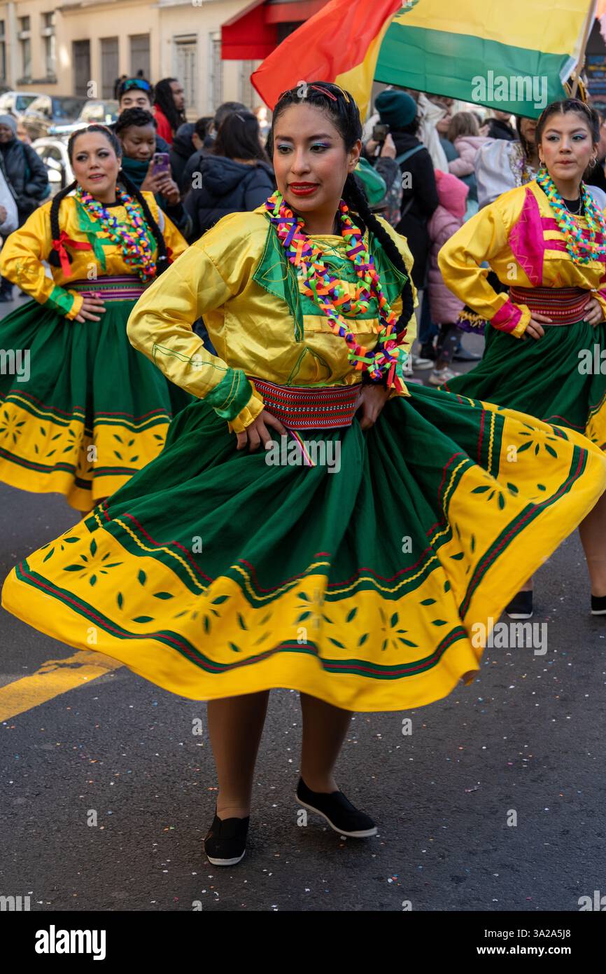 Vibrant dancers illuminate the streets of Paris during the exuberant ...