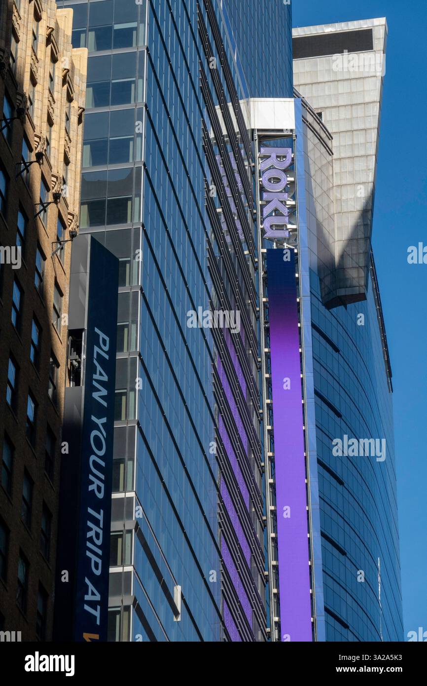 The skyscrapers and office buildings in Times Square are covered in ...