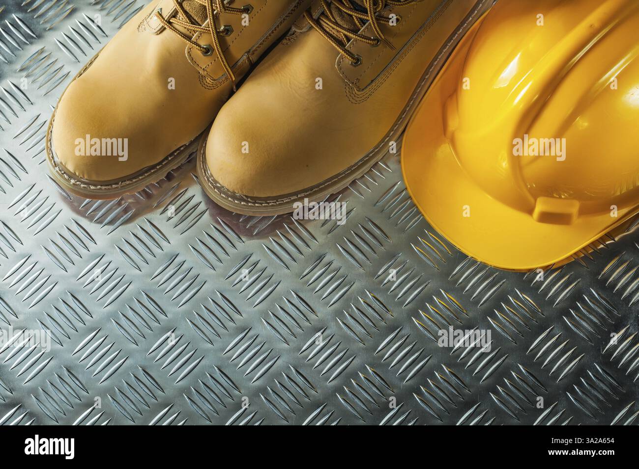 Safety boots building helmet on corrugated metal sheet Stock Photo - Alamy
