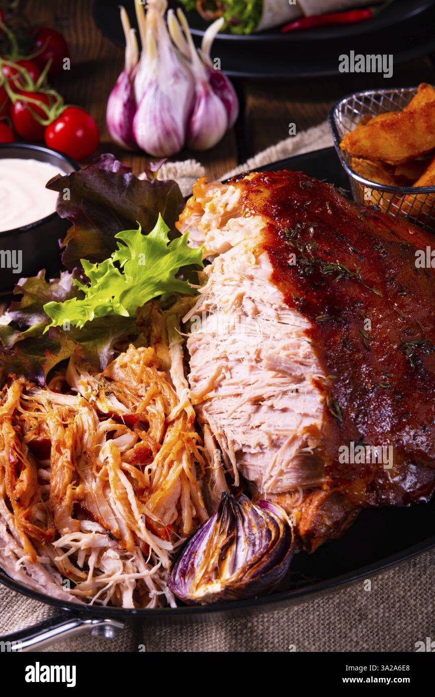 Delicious pulled pork with jacket potato quarters Stock Photo - Alamy