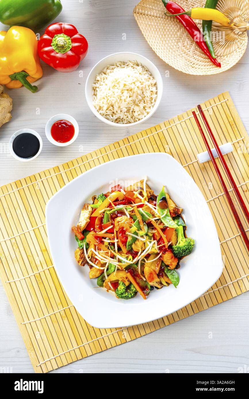 Sweet and sour chicken with rice and vegetables Stock Photo - Alamy