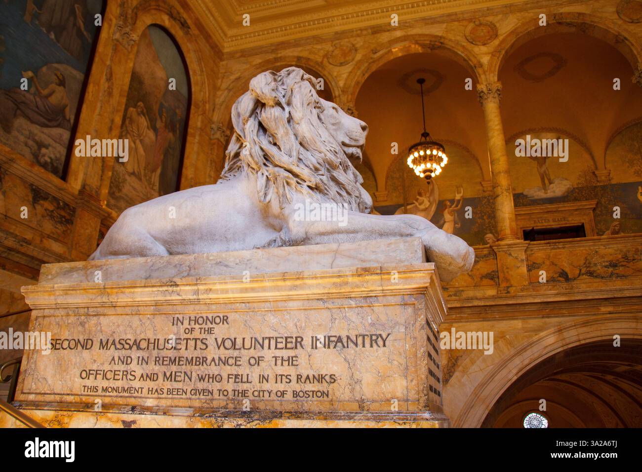 Inside the beautiful ornate Boston Public Library, a large lion ...