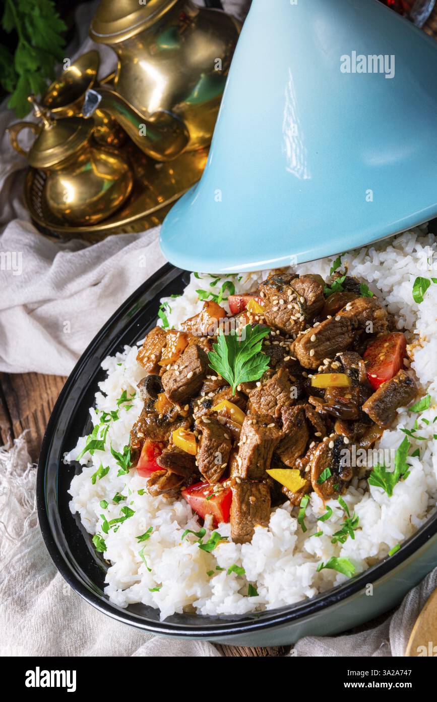 Tajin beef stew with rice, peppers and sesame seeds Stock Photo - Alamy