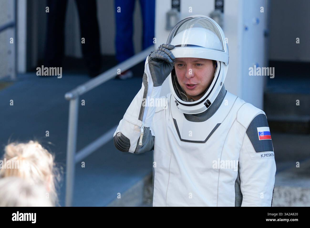Cosmonaut Kirill Peskov greets family and friends as he leaves the ...