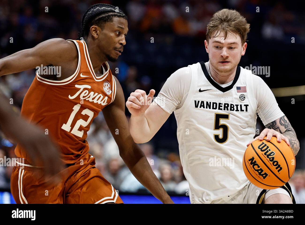 Vanderbilt guard Tyler Nickel (5) moves against Texas guard Tramon Mark ...