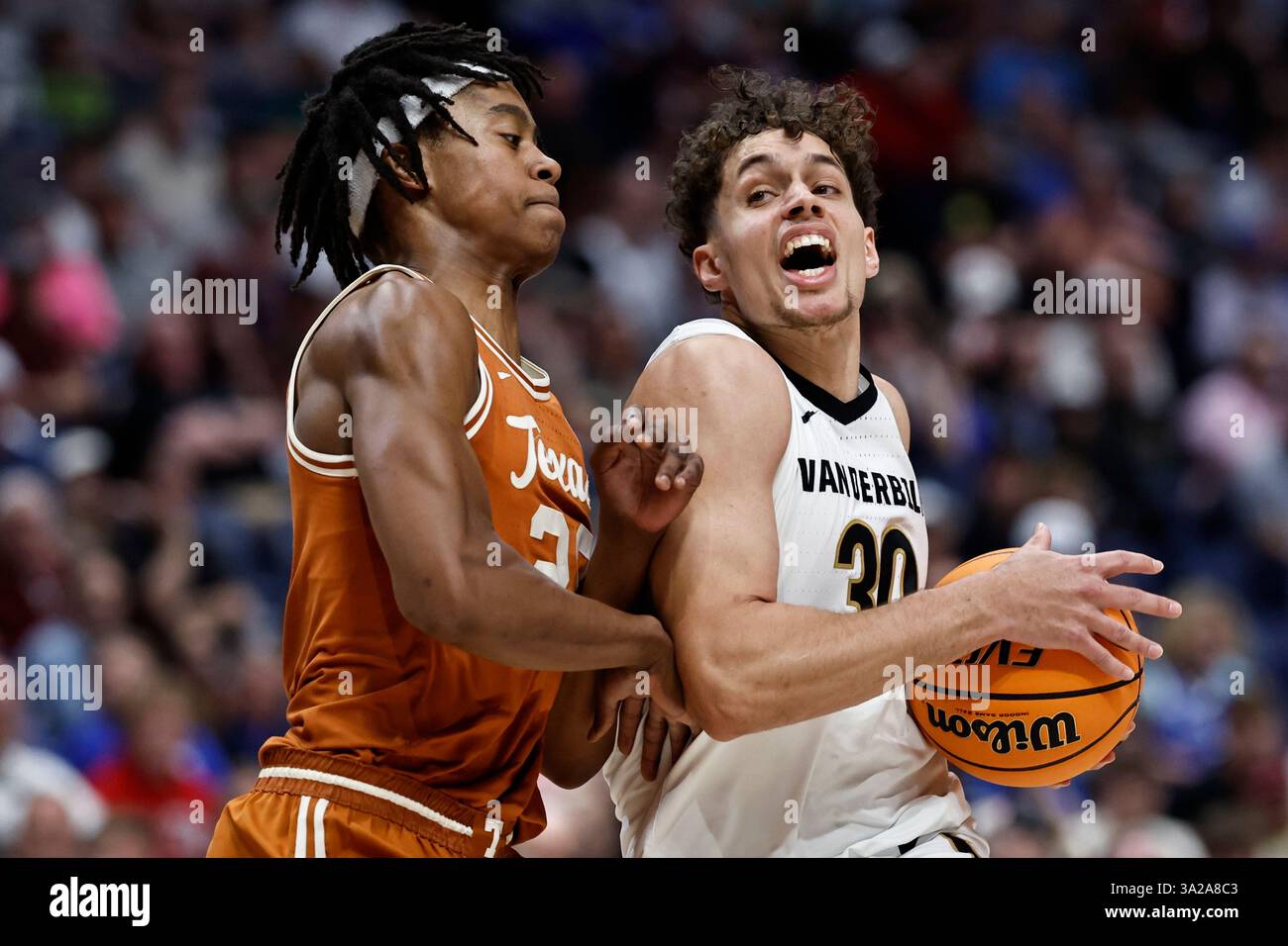 Vanderbilt guard Chris Manon (30) drives against Texas forward Jayson ...