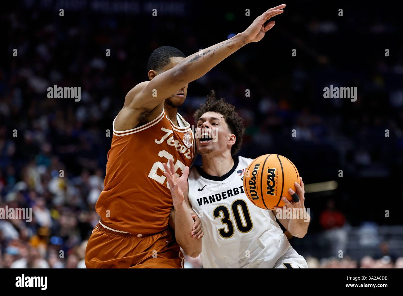 Vanderbilt guard Chris Manon (30) drives against Texas forward Jayson ...
