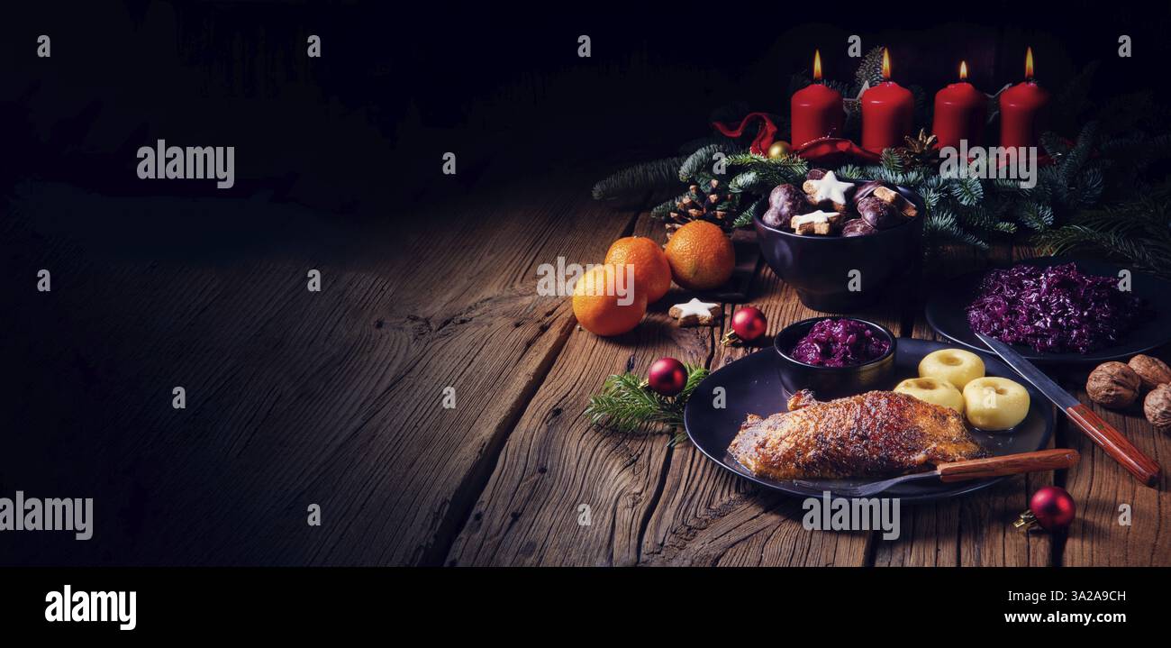 Roast goose with baked apples, red cabbage and dumplings Stock Photo ...