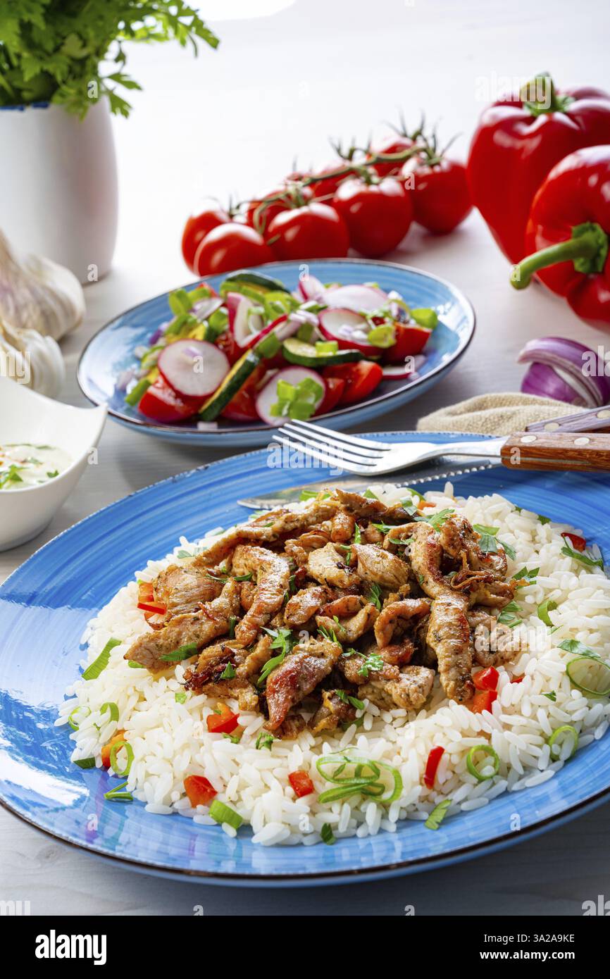 Gyros with rice, green salad and tzatziki Stock Photo - Alamy