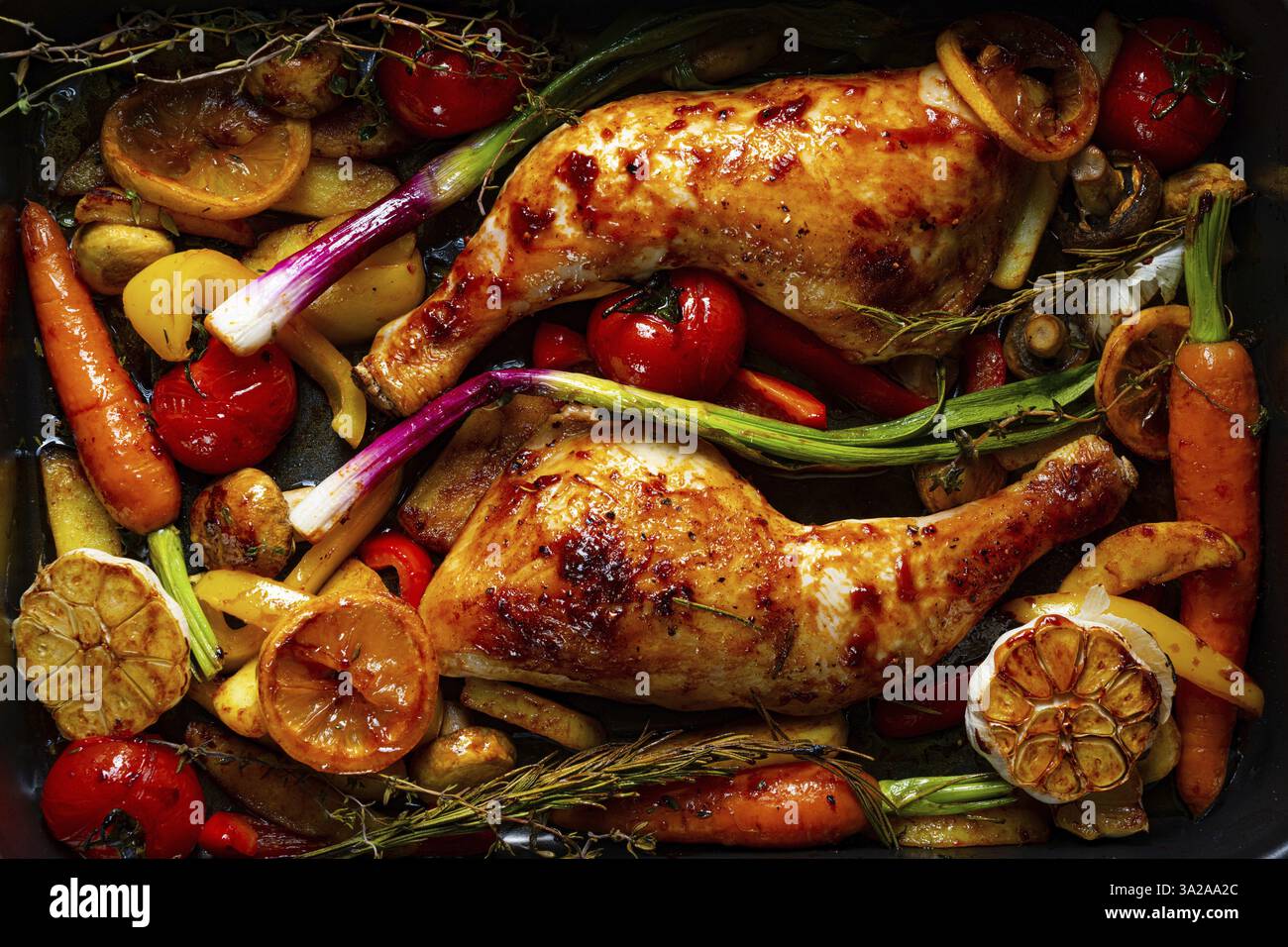 Roasted chicken legs with various vegetables Stock Photo - Alamy