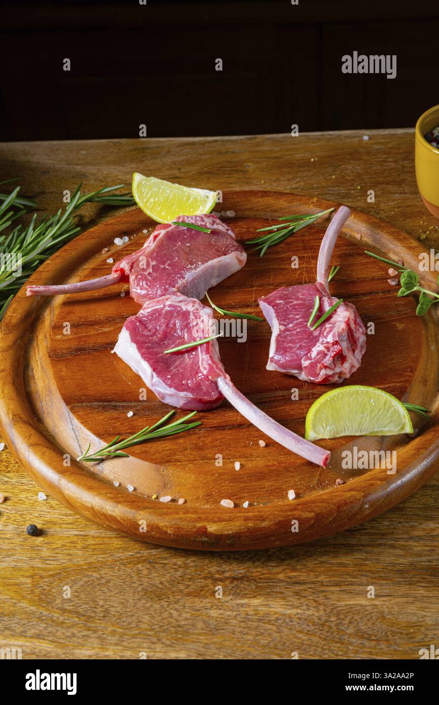 Raw fresh lamb chops Wooden chopping board Stock Photo - Alamy