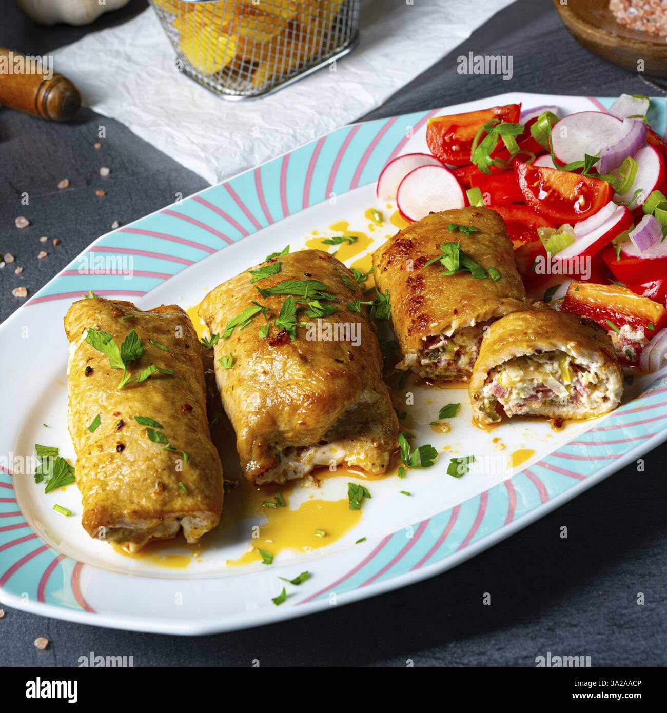 Roast pork vegetable roulade with salads Stock Photo - Alamy