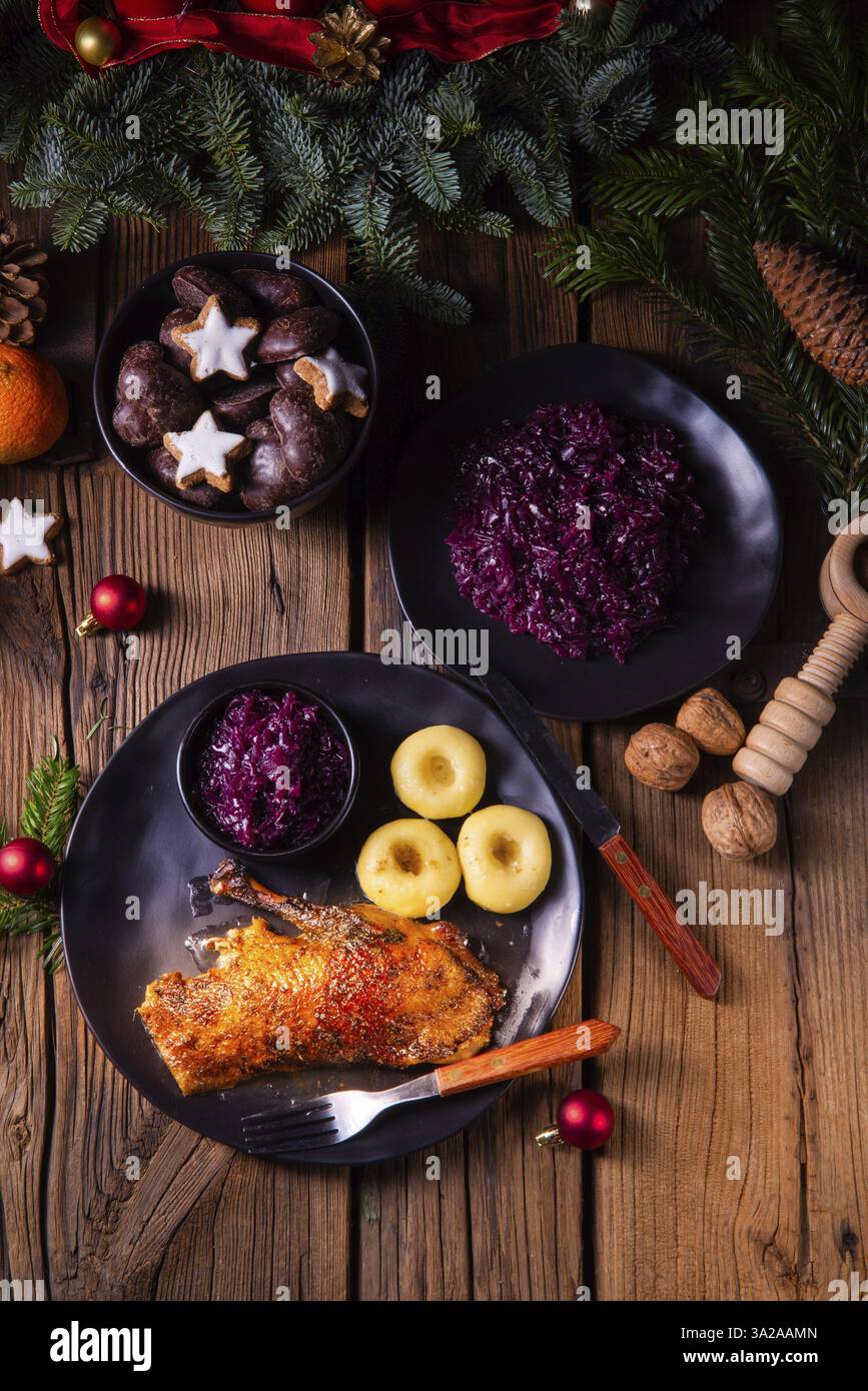 Roast goose with baked apples, red cabbage and dumplings Stock Photo ...