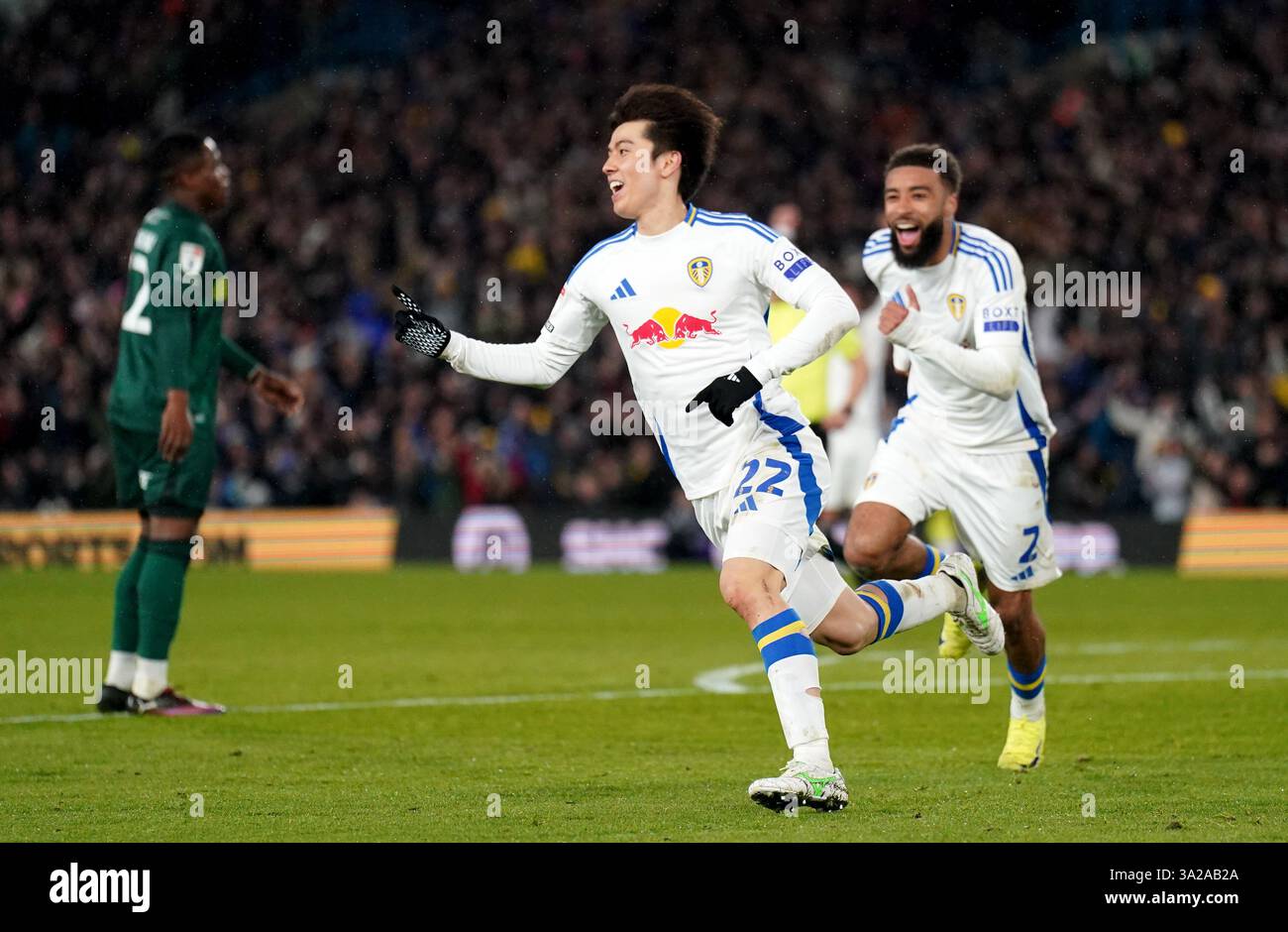 Leeds United's Ao Tanaka (left) celebrates after scoring his sides ...