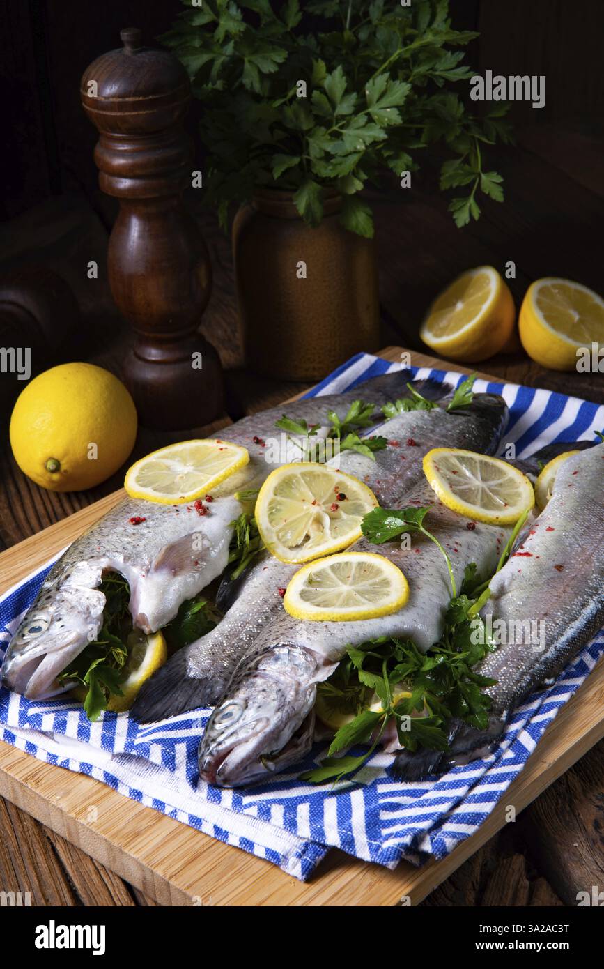 Fresh trout with lemon and various herbs Stock Photo - Alamy