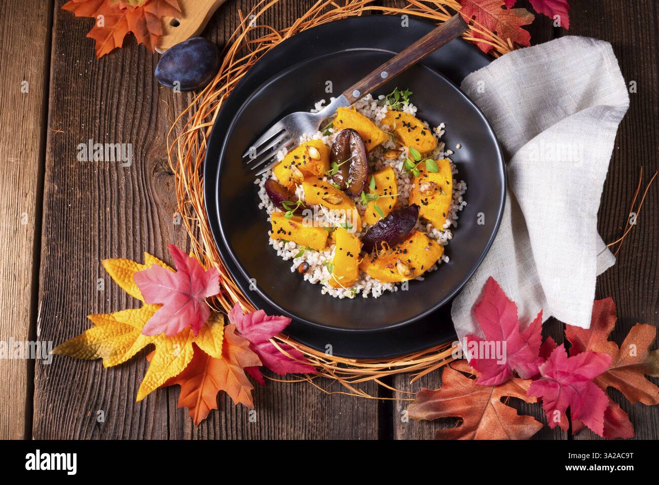 Gratinated vegetarian pumpkin with barley, oats, plums and thyme Stock ...
